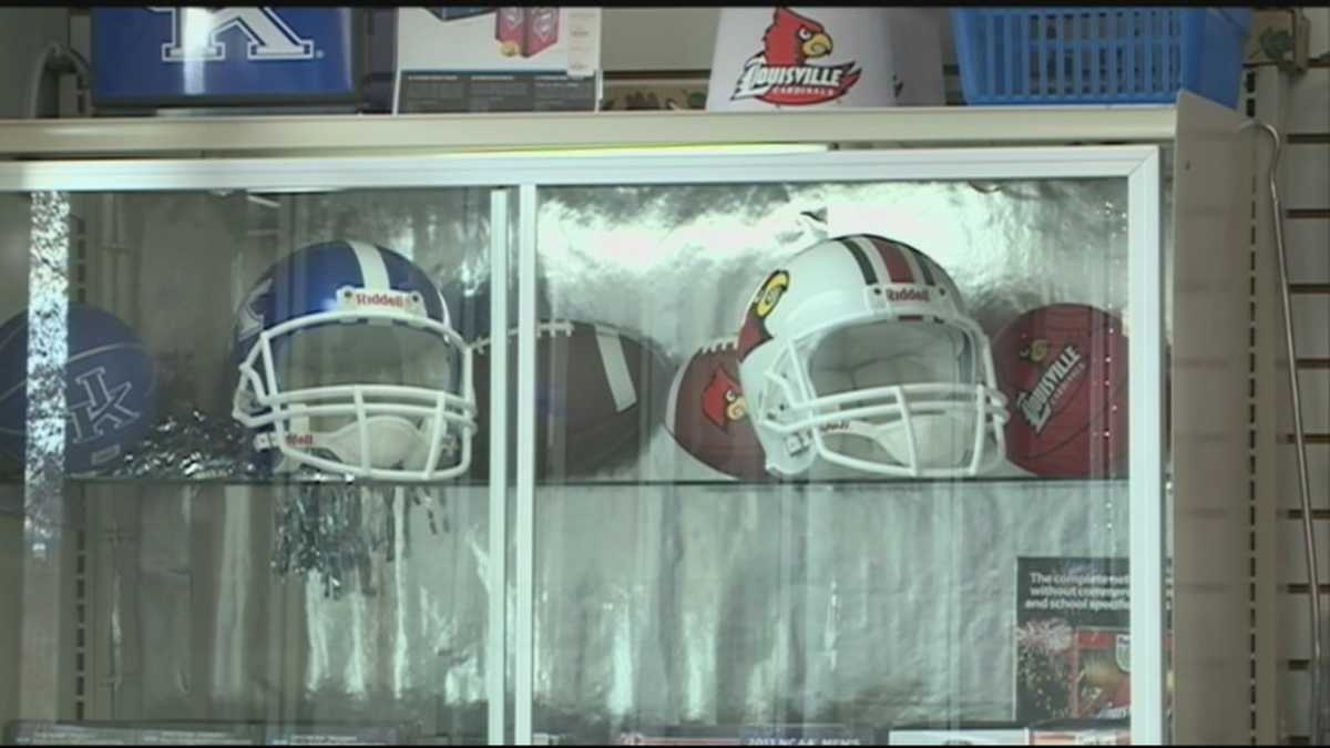 Football fans flock to find UofL,UK gear