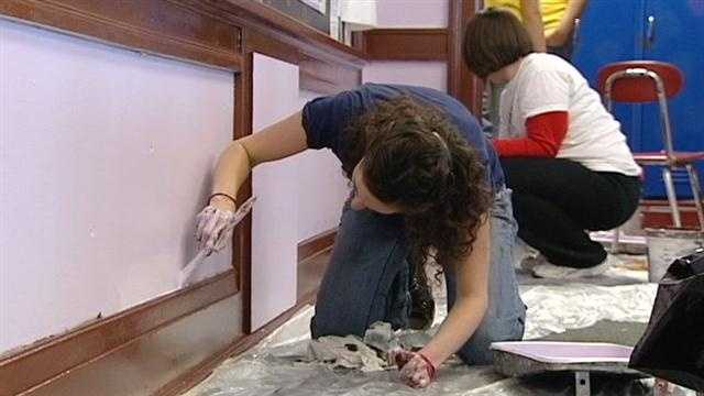 Volunteers spend the day fixing up schools