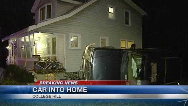 Car hits house; Police say driver arrested
