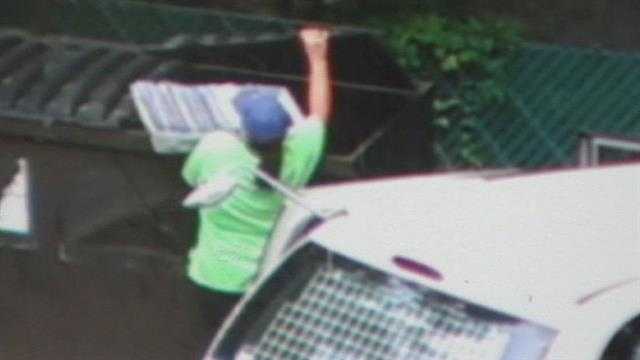 Postal worker seen throwing mail in dumpster fired, charges possible