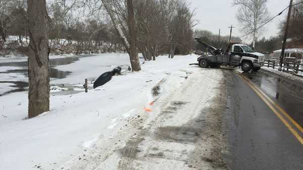 Images: Car crashes into river