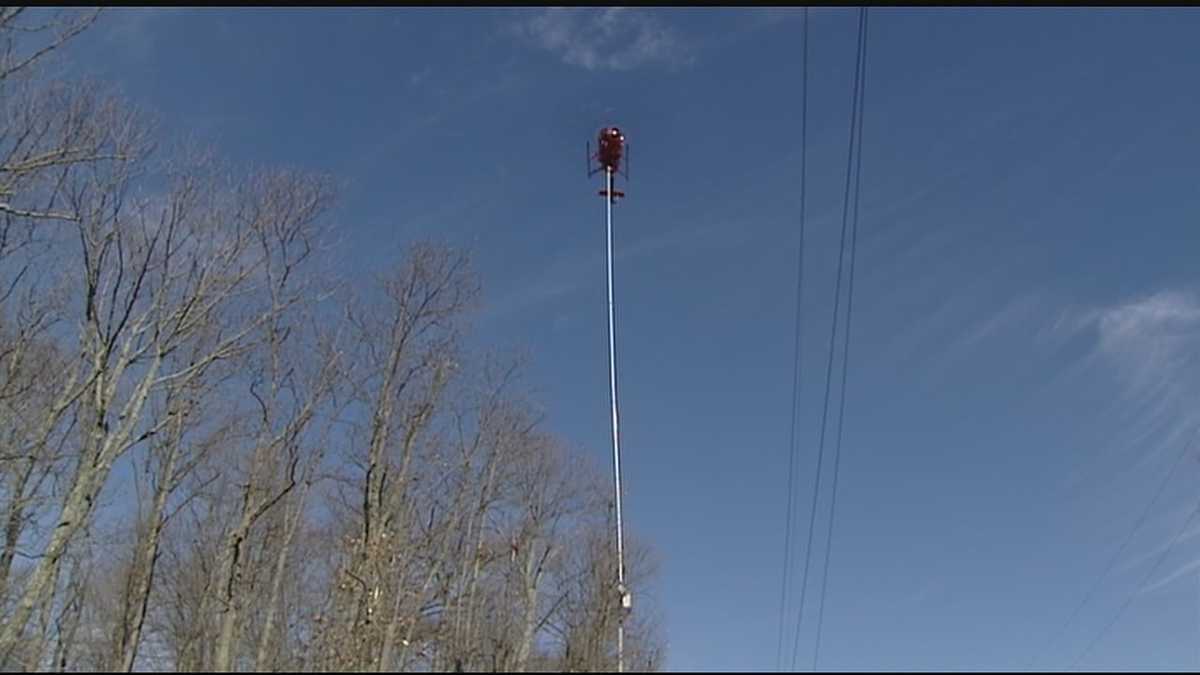 Crews use giant chainsaw dangling from helicopter to trim trees