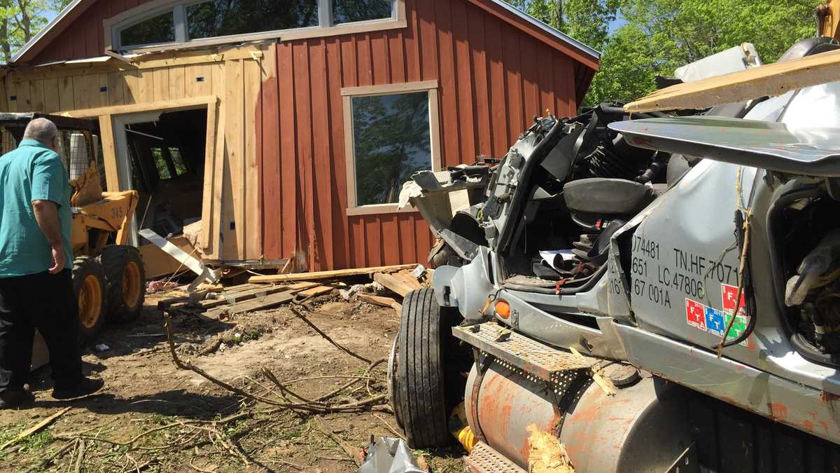 Photos: Driver killed when semi hits house
