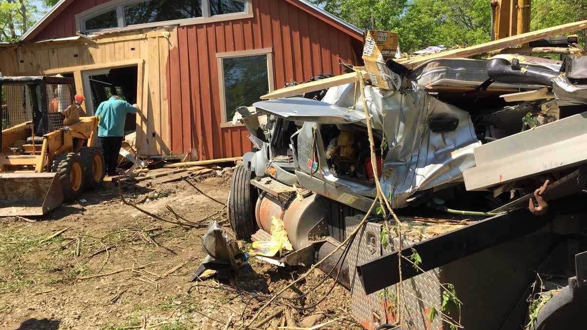 Photos: Driver killed when semi hits house