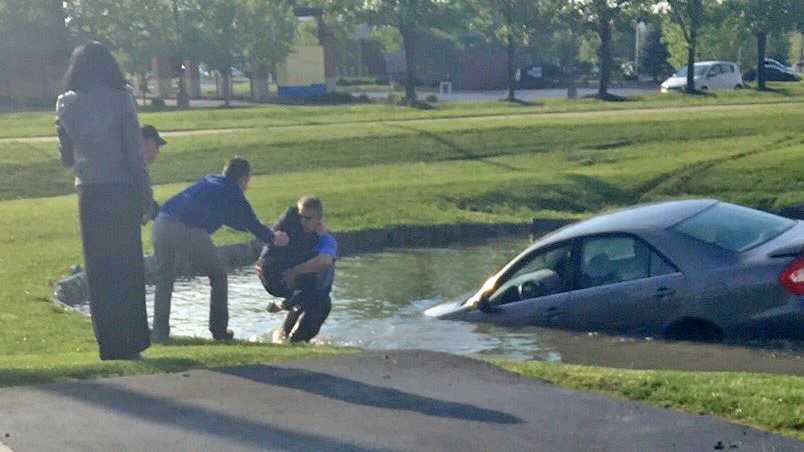 Photos: Man rescues woman from car in pond
