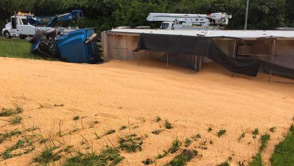 Photos: Crash spills corn along highway ramp