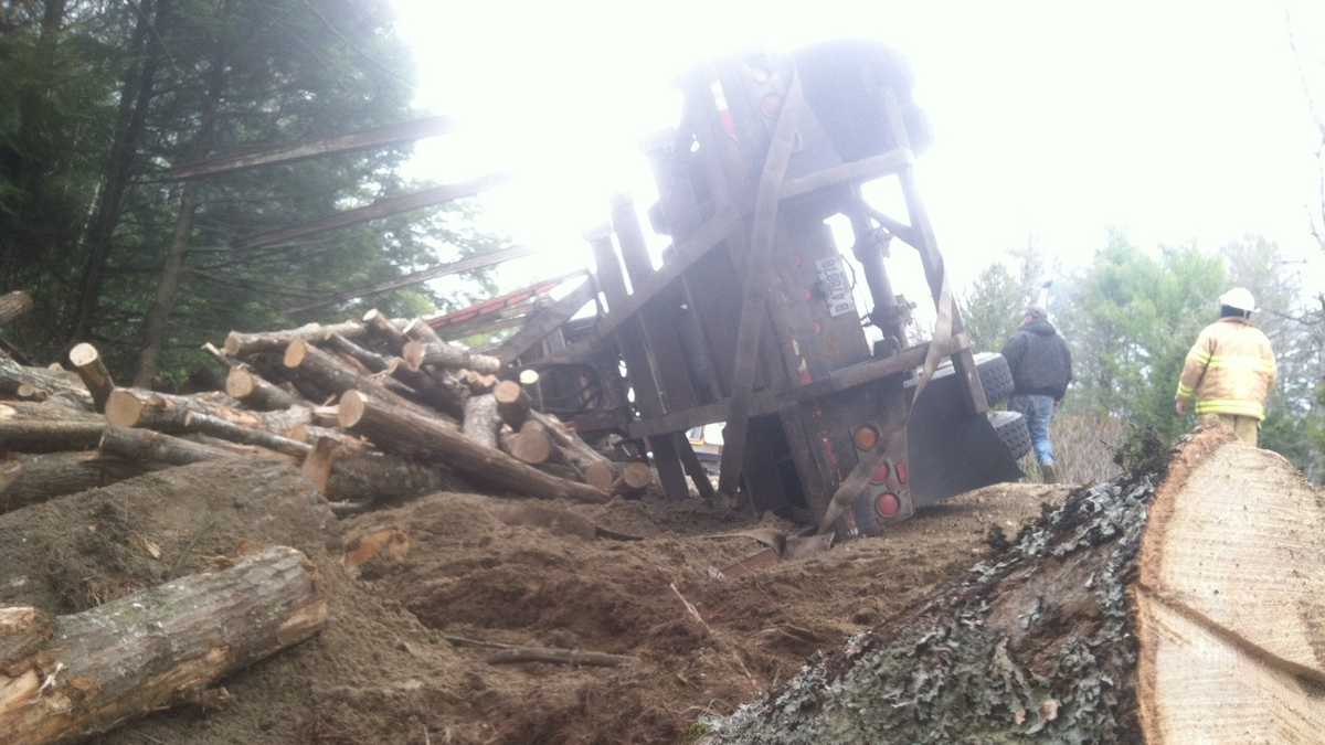 Photos: Logging truck rolls over