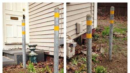 Woman upset by poles placed around gas meter