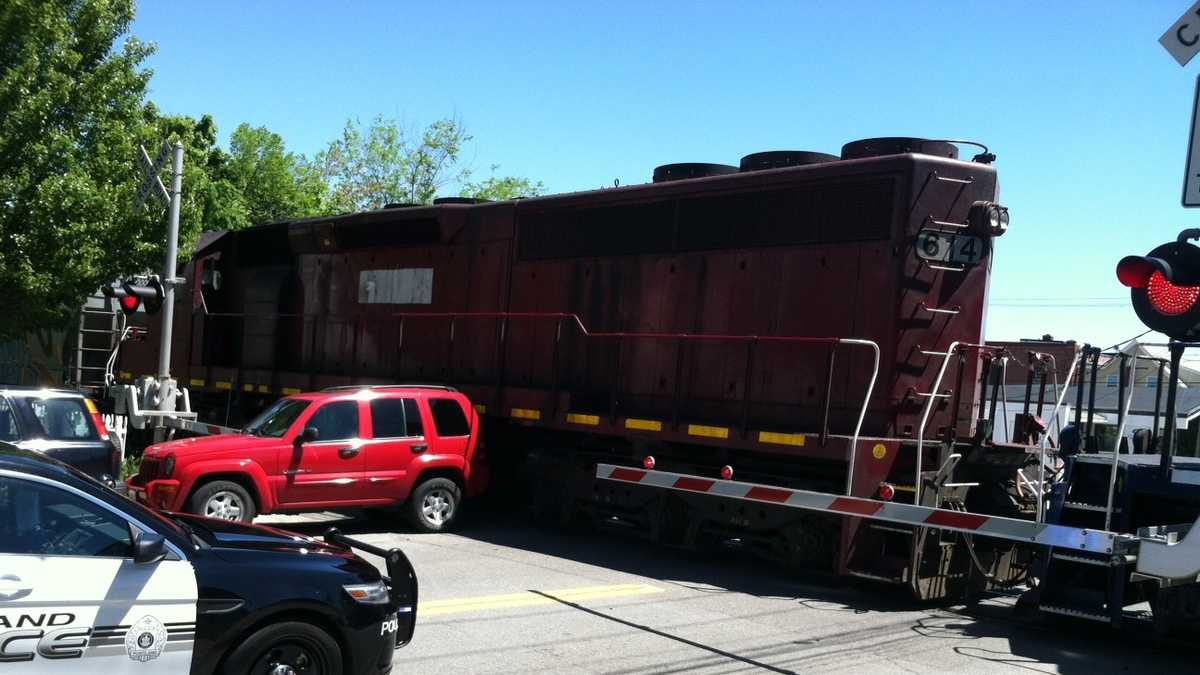 Photos: Train hits SUV at Woodford's Corner