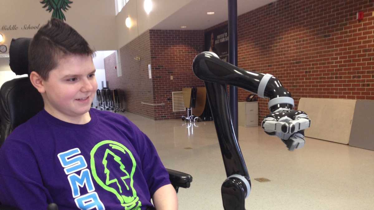 Teen with muscular dystrophy tests robotic arm
