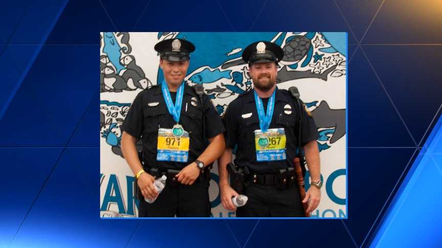 Portland police officers run half marathon in full uniform