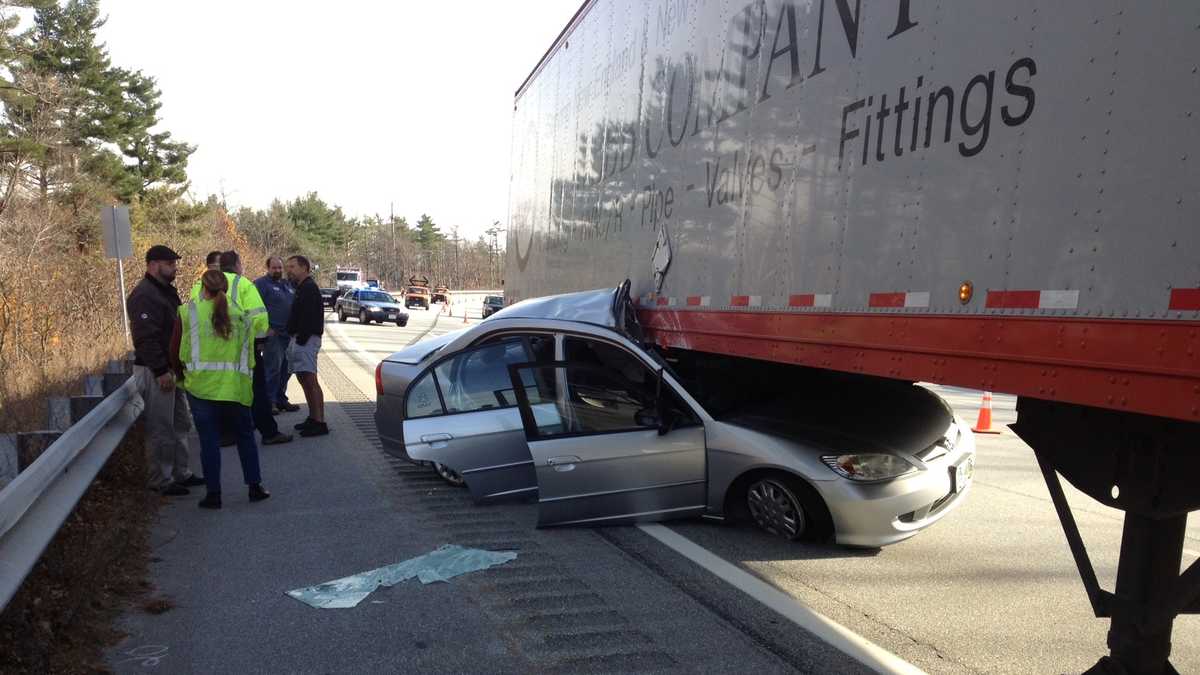 Images: Car crashes into tractor trailer, gets dragged 200 yards