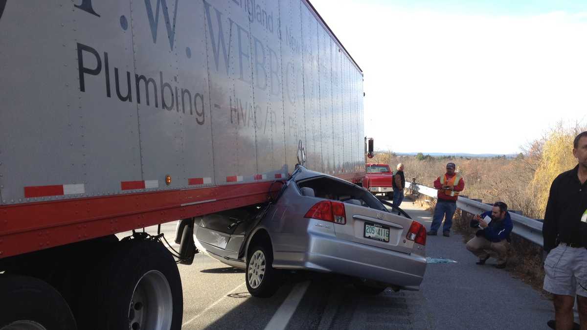 Images: Car crashes into tractor trailer, gets dragged 200 yards