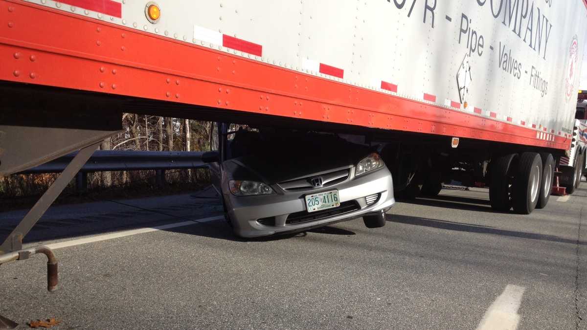 Images: Car crashes into tractor trailer, gets dragged 200 yards
