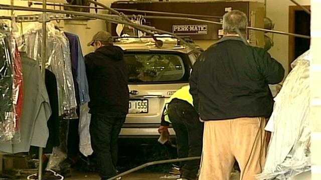 Car crashes into Manchester dry cleaner