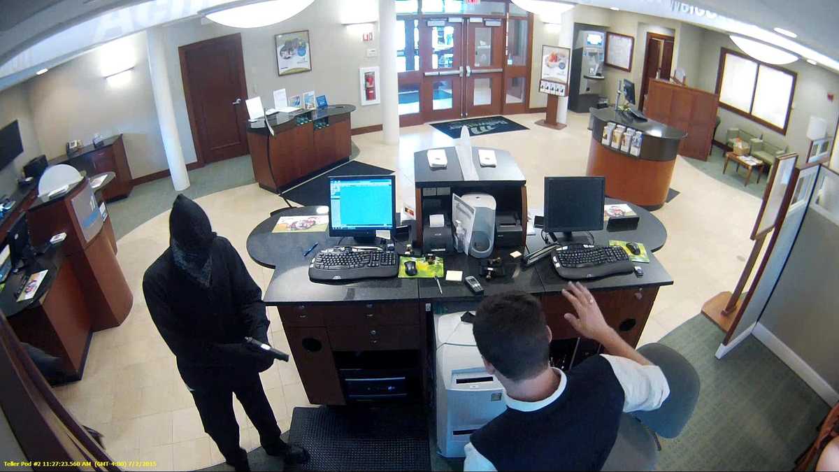 Surveillance photos show bank robbers in Nashua