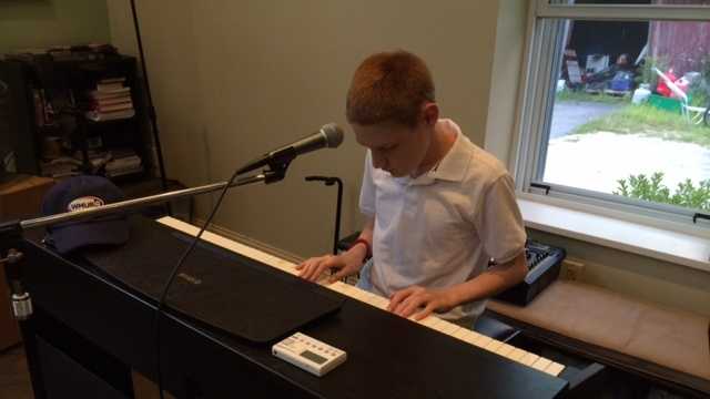 Manchester blind, autistic boy sings national anthem at Fenway