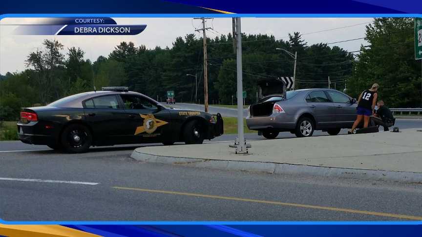 State trooper stops to help change tire