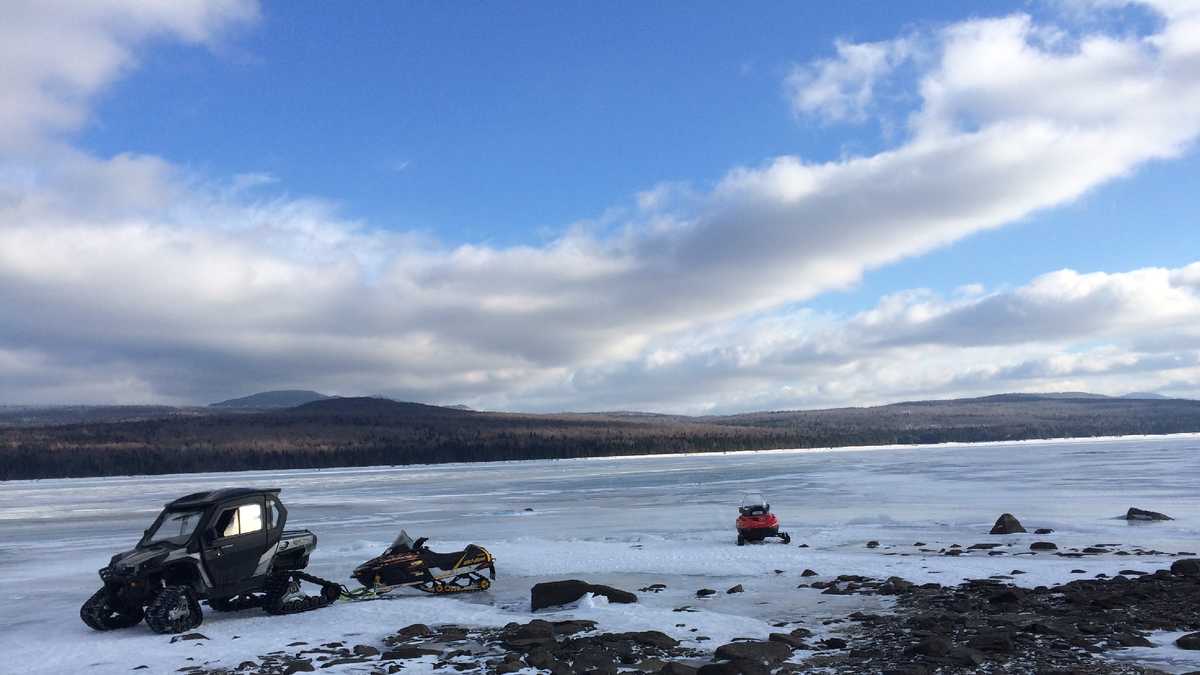 Rescuers find teens standing atop snowmobiles submerged in icy lake
