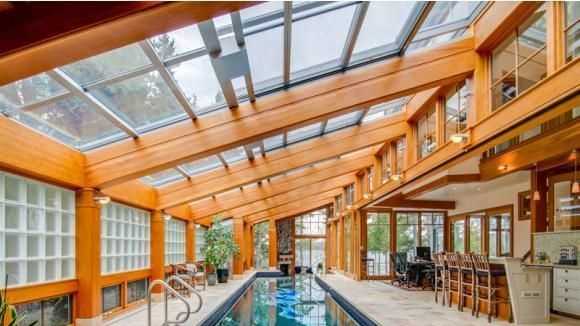 Mansion Monday: Lakeside home has glass walls, 2-story waterfall ...
