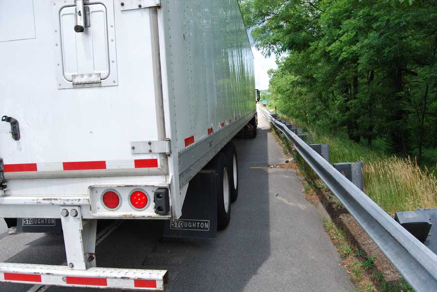 Photos: State police cruiser sideswiped by tractor-trailer