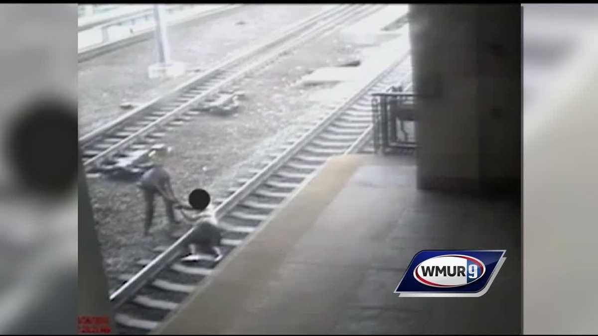 Officer pulls man from tracks just before train arrives
