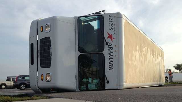 Aramark truck ends up on its side after colliding with SUV