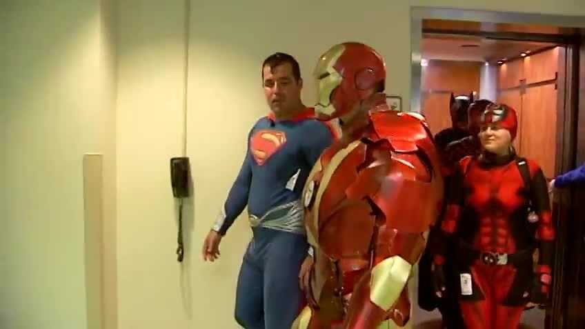 Photos: Man plays superhero for sick kids