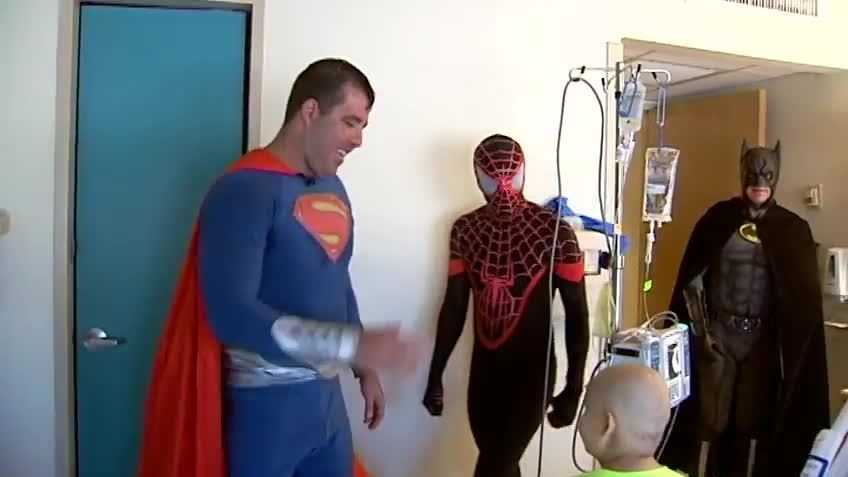Photos: Man plays superhero for sick kids
