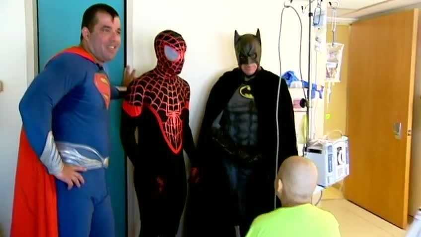 Photos: Man plays superhero for sick kids