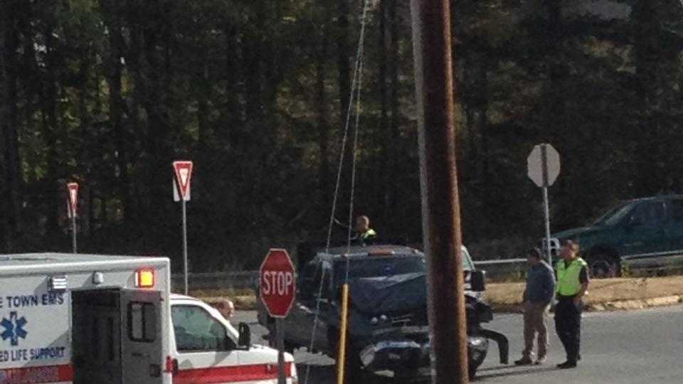 Photos: Crash causes school bus to overturn