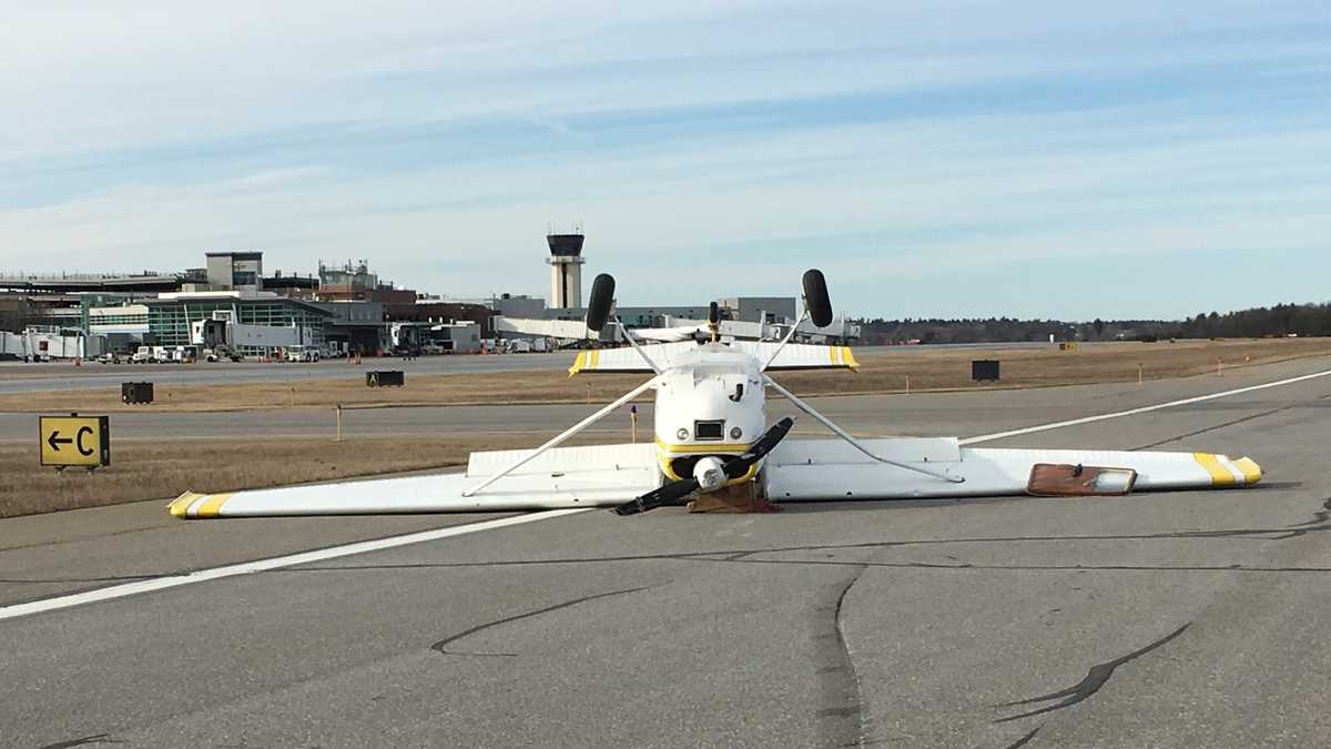 Small plane flips over due to cross wind