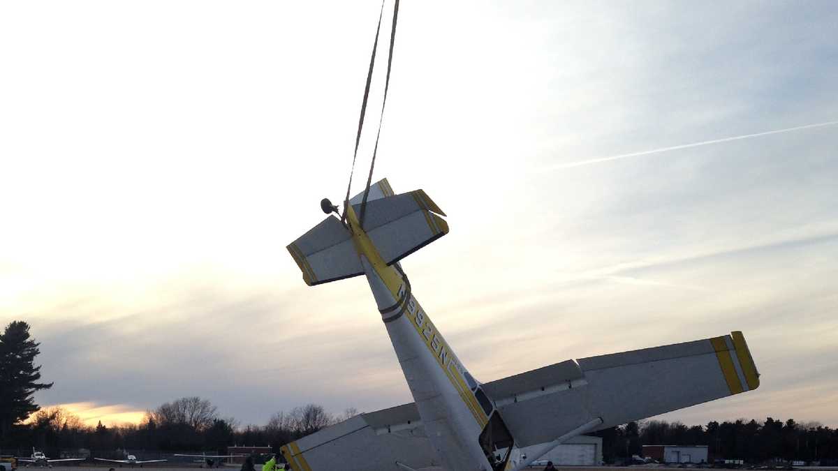 Small plane flips over due to cross wind