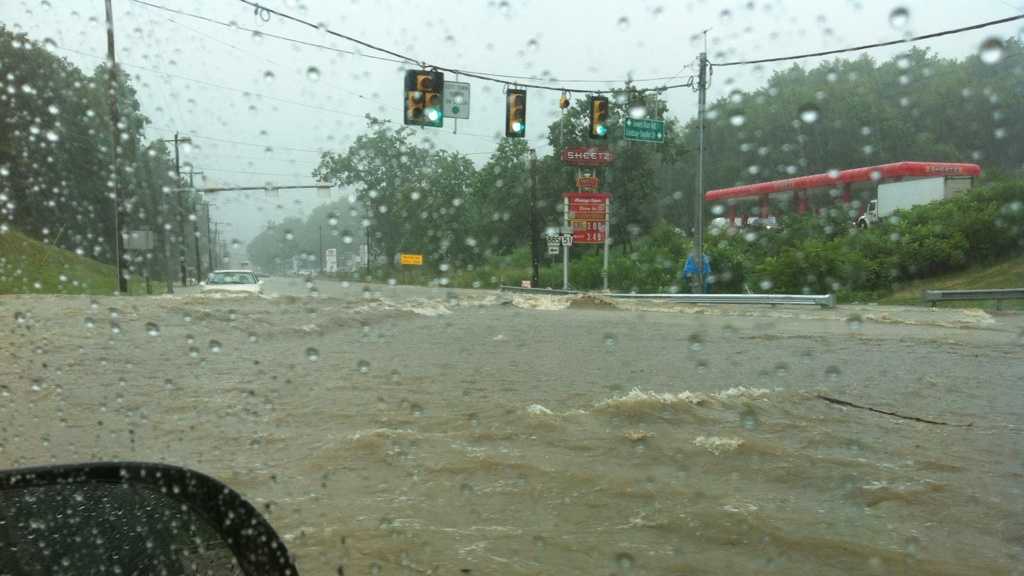 Flash flooding fills streets with water, closes intersections