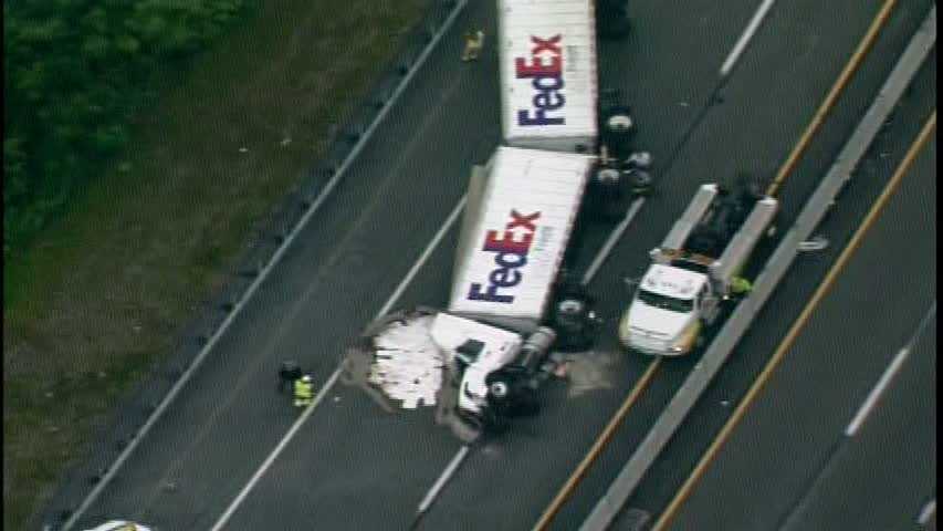 In Photos: FedEx tractor-trailer flips over on Turnpike