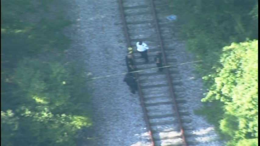 Teen found dead near train tracks