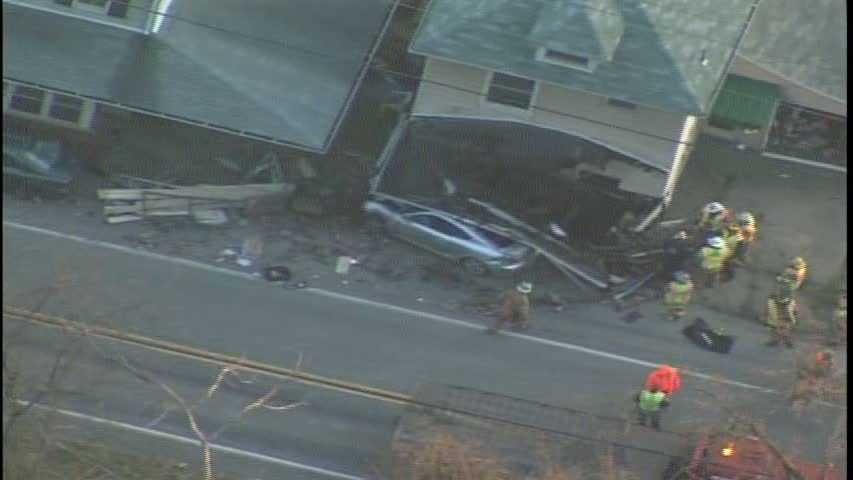 Car crashes into home, collapses porch roof
