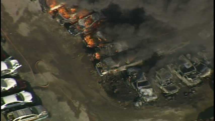 Photos: Fire rages at auto salvage yard