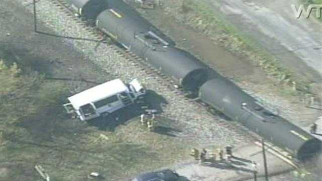 In photos: Train hits bus