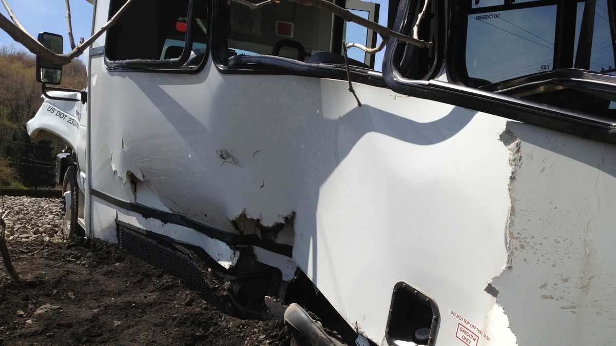 In photos: Train hits bus
