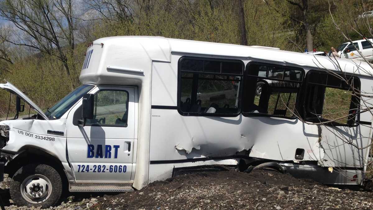 In photos: Train hits bus