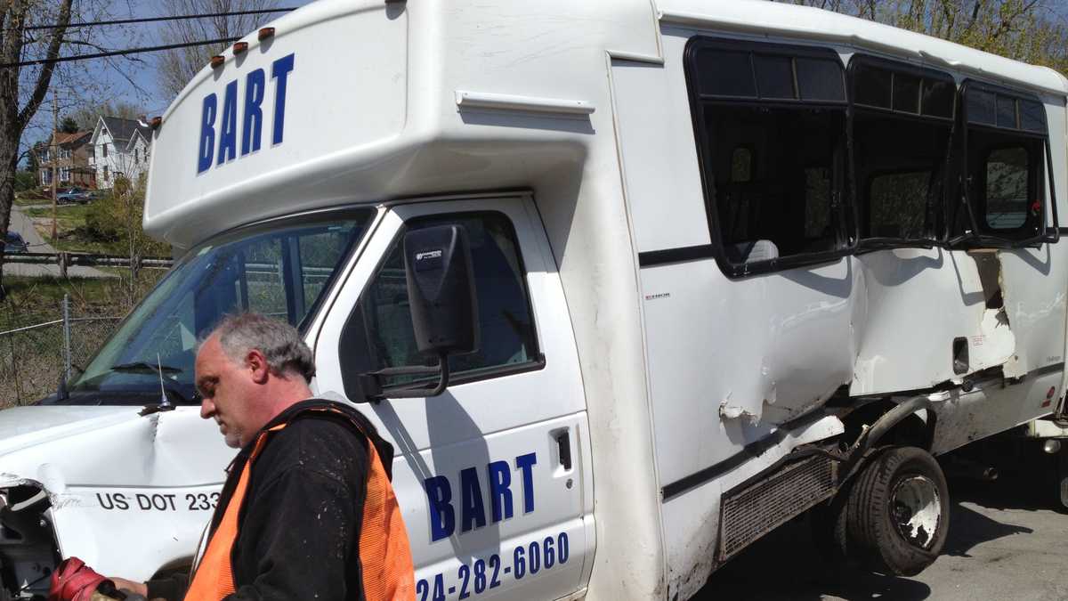 In photos: Train hits bus