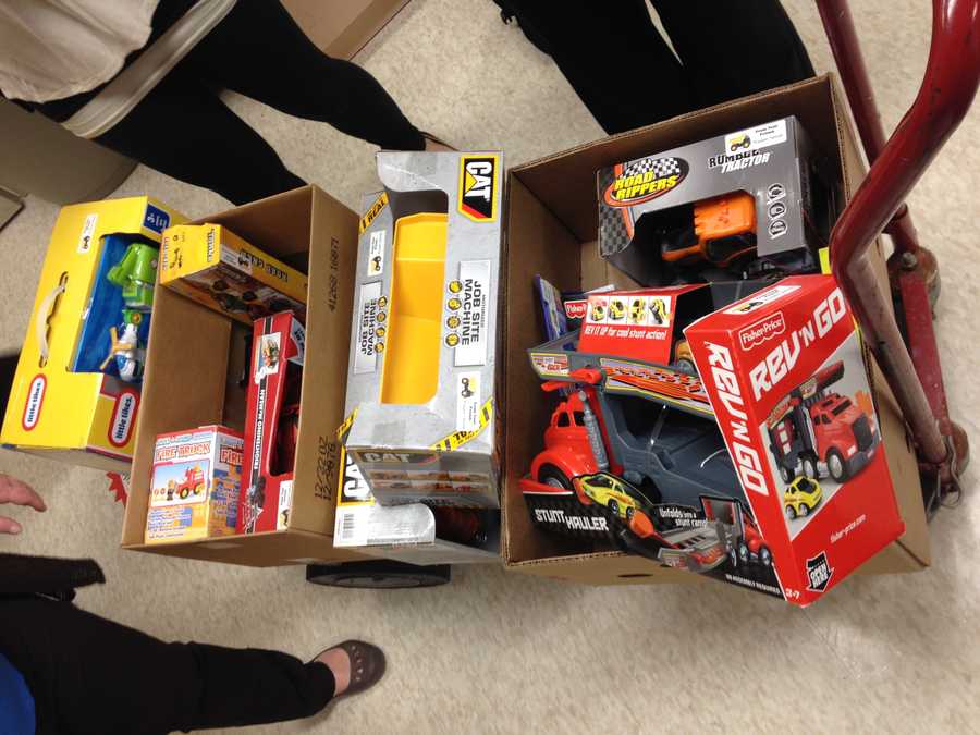 Toy truck drive collects holiday gifts in boy's honor after zoo death