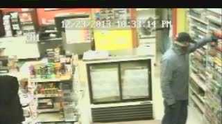 Photos: Surveillance video shows armed robbery at EZ Mart