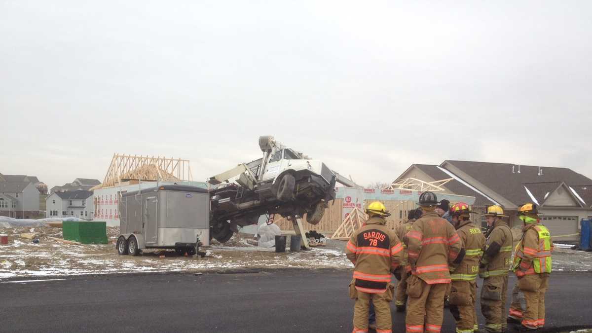 Crane tips onto house under construction in Plum