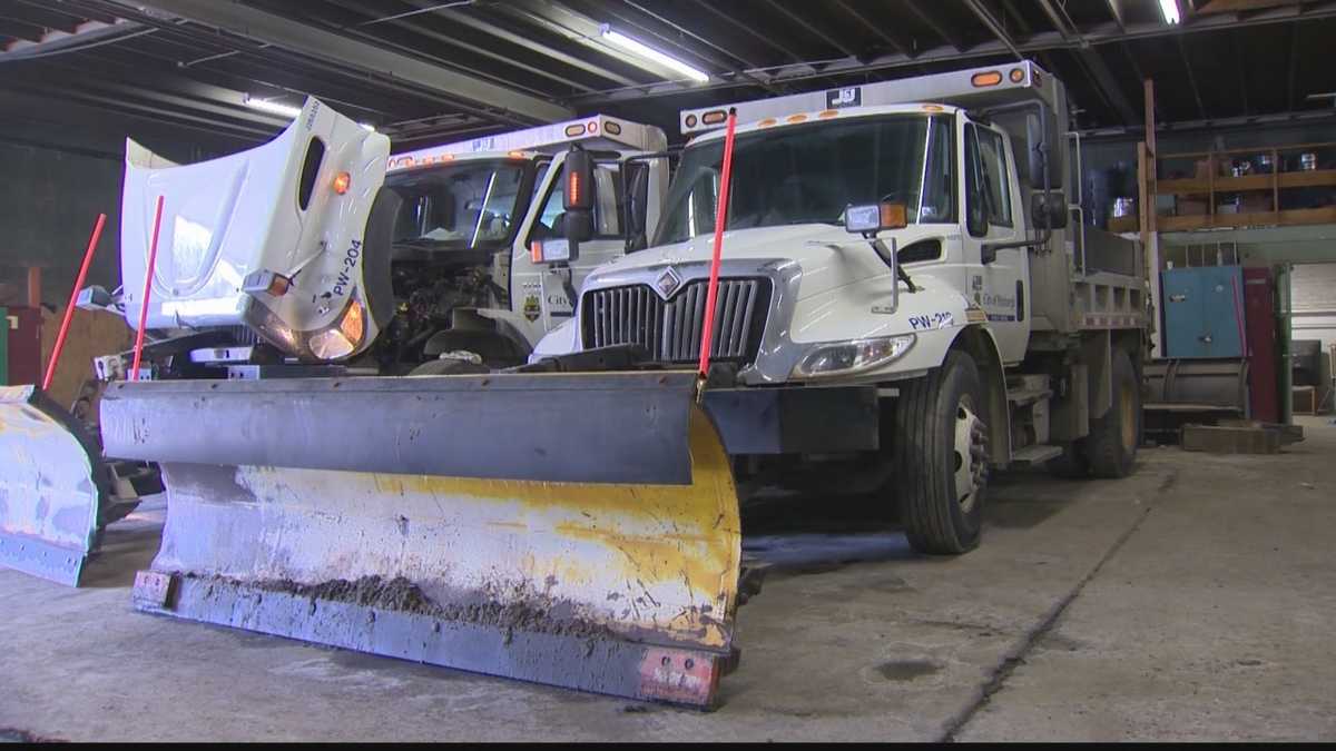 City worker plows private lot with Public Works vehicle