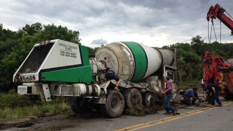 Photos: Cement truck crashes over side of Route 228