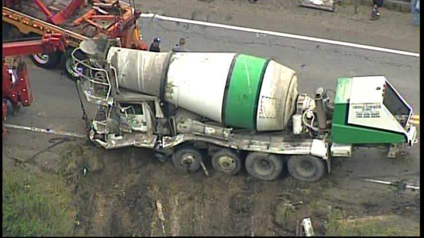 Photos: Cement truck crashes over side of Route 228