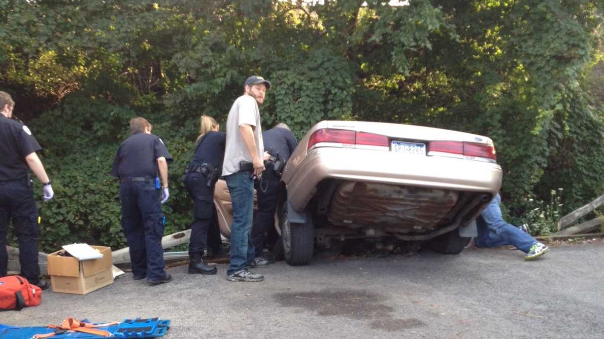 Sharpsburg police save man trapped in car, teetering on edge