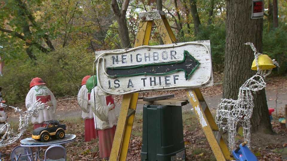 Offensive signs and "trashed" figurines surround a home once a holiday ...